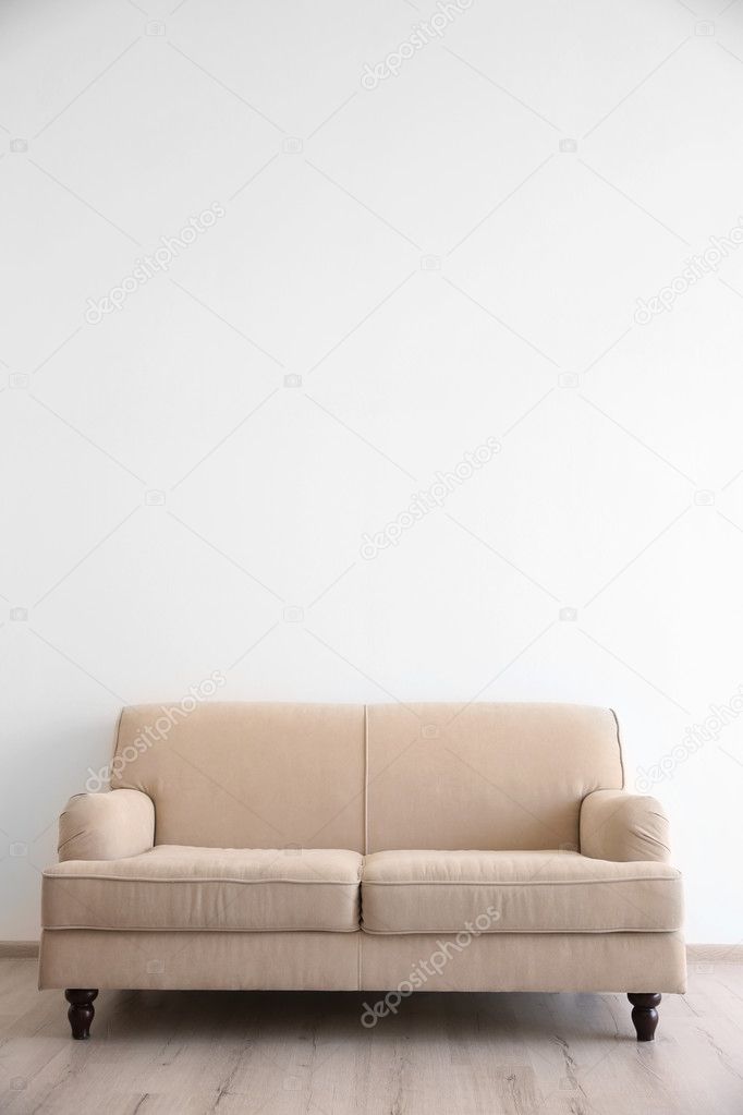 Cozy couch on background Stock Photo by ©belchonock 110567384