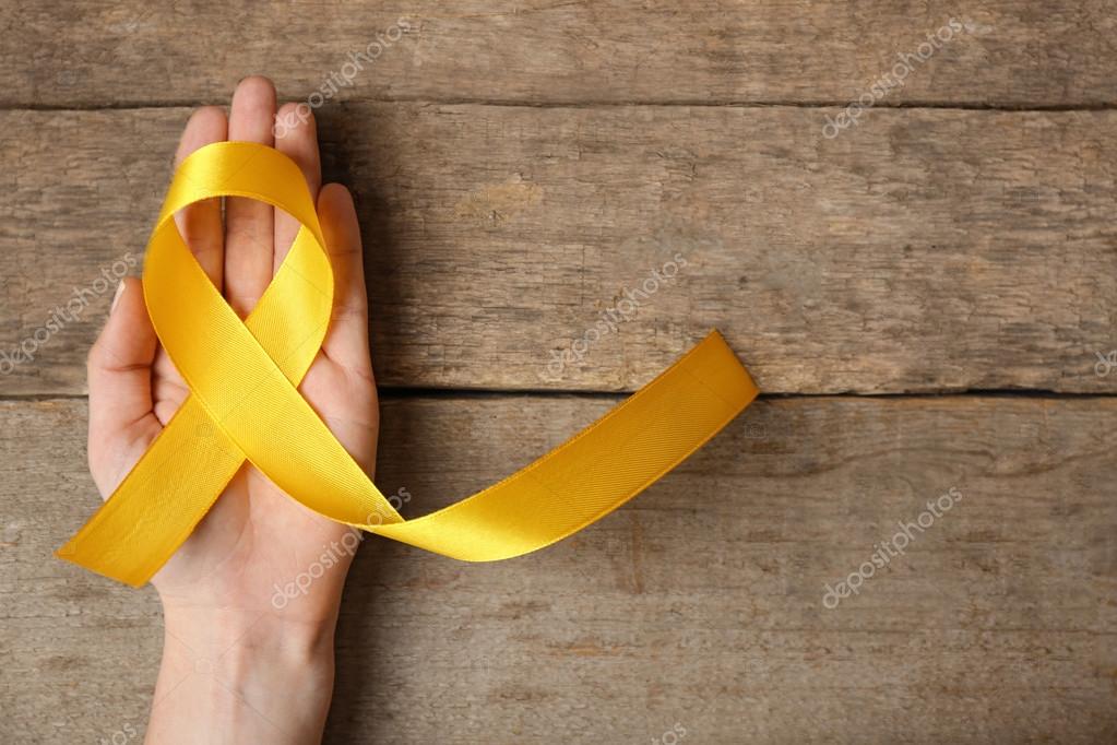 Yellow awareness ribbon — Stock Photo © belchonock #112066140 Yellow awareness ribbon — Stock Photo © belchonock #112066140