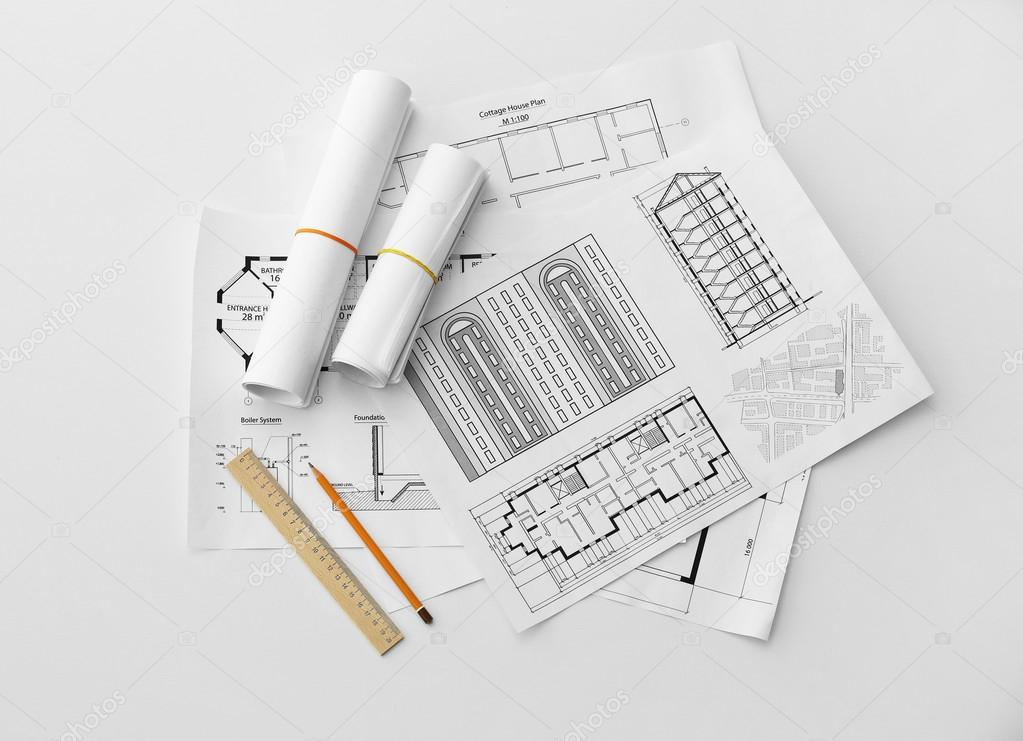 Architecture blueprints on table Stock Photo by ©belchonock 113531588