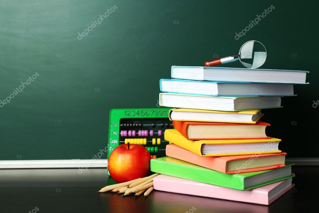 School books on desk Stock Photo by ©belchonock 113556058