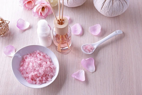 Beautiful spa composition with spring flowers on wooden background ...