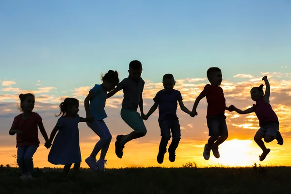 Happy Kids Silhouettes Sunset Background Stock Photo by ©belchonock ...
