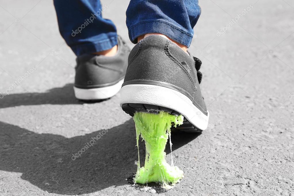 Foot stuck into chewing gum — Stock Photo © belchonock #120328998