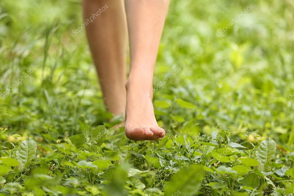 Female legs on grass Stock Photo by ©belchonock 120329618