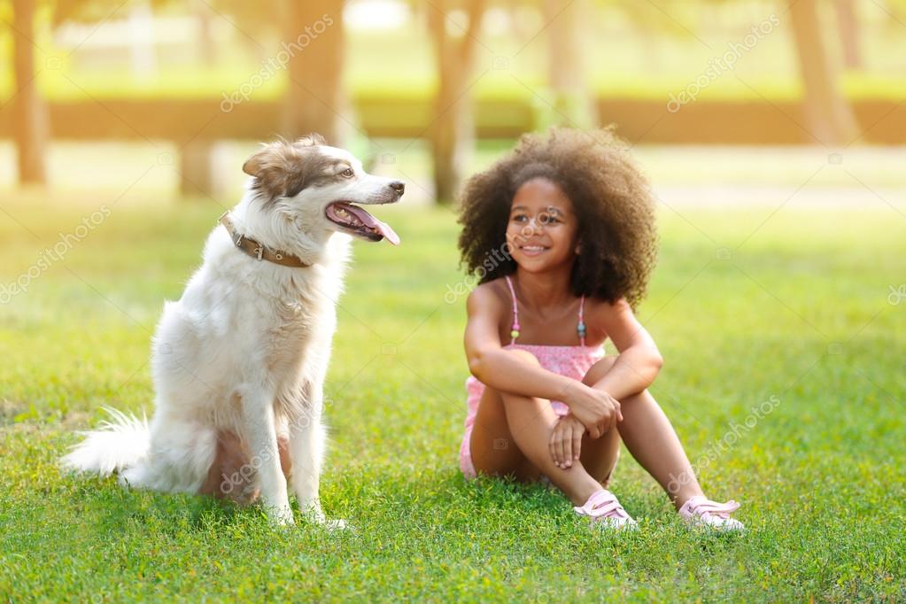 African American girl with dog Stock Photo by ©belchonock 120330508
