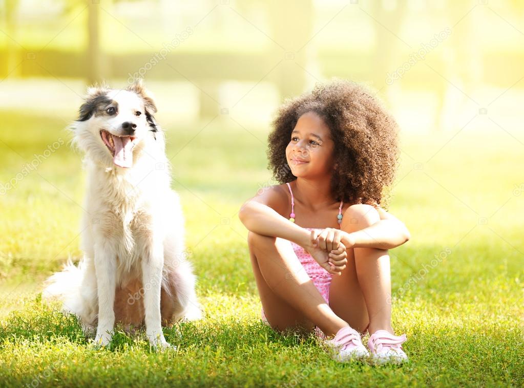 African American girl with dog Stock Photo by ©belchonock 120330516