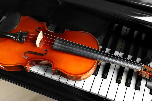 Violin on piano keys, closeup - Stock Image - Everypixel