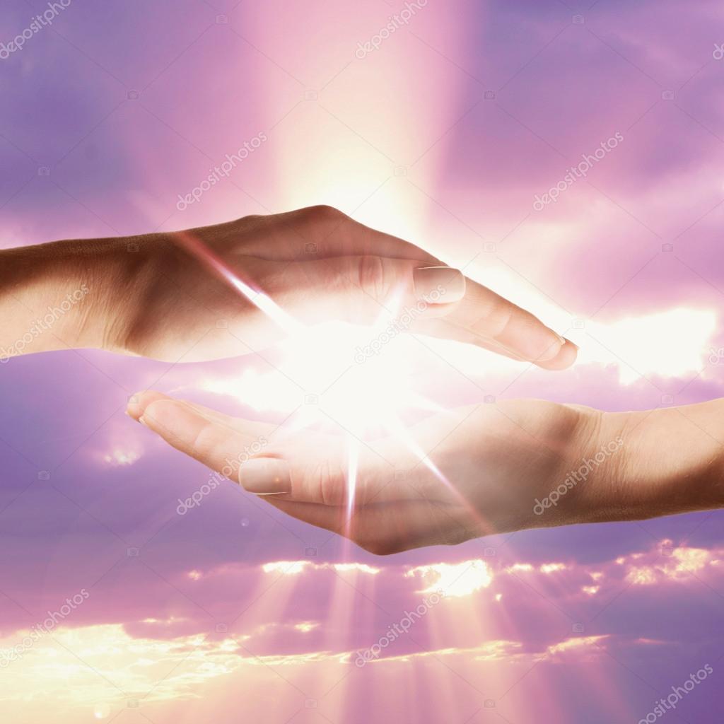 Female hands holding sunlight Stock Photo by ©belchonock 120602664