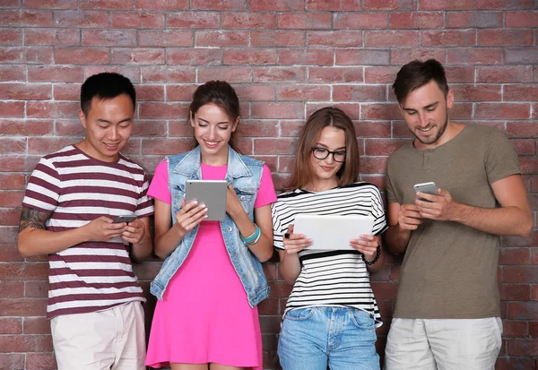 Young people with gadgets - Stock Image - Everypixel