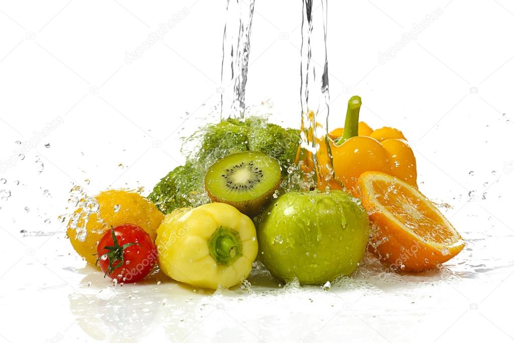 Vegetables with splashing water Stock Photo by ©belchonock 122774026