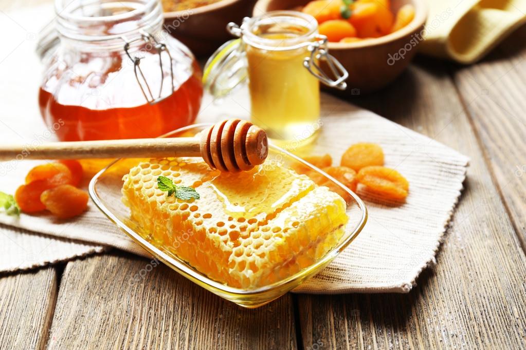 Fresh honey on wooden table — Stock Photo © belchonock #51906697
