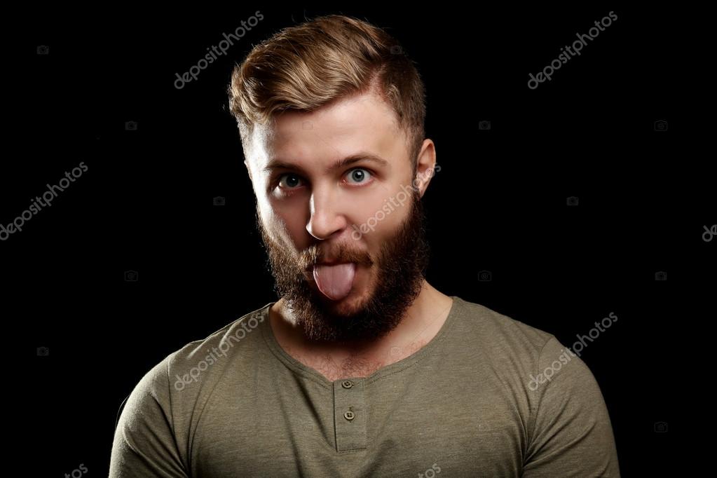 Portrait of handsome man with beard on black background Stock Photo by ...