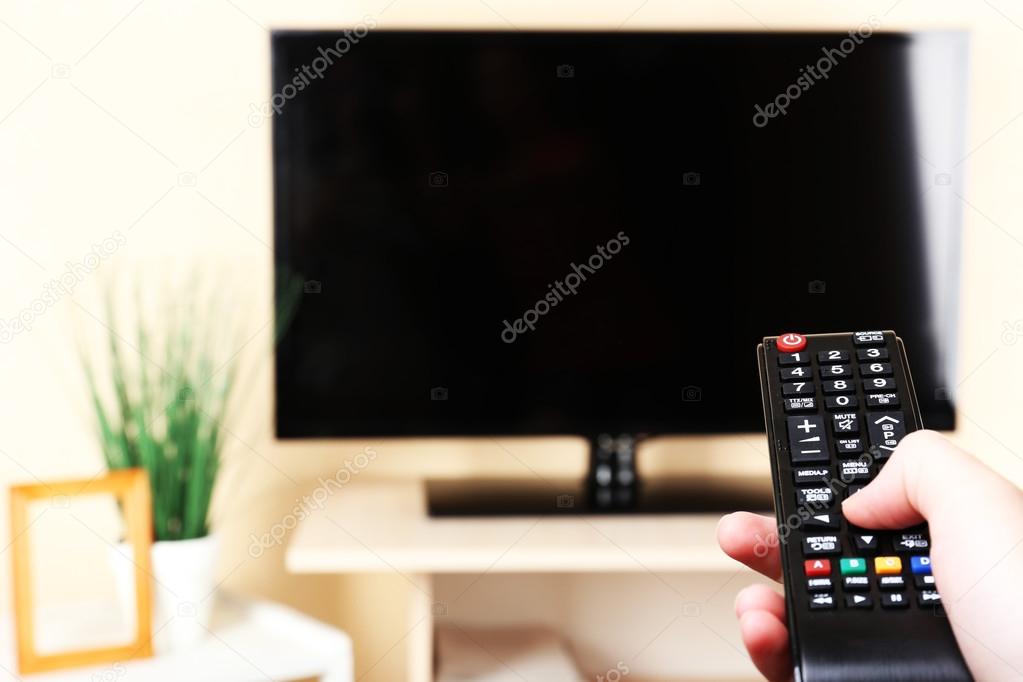 Using remote controller — Stock Photo © belchonock #54285583