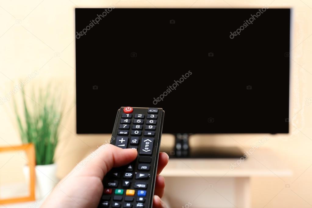 Using remote controller — Stock Photo © belchonock #54285589