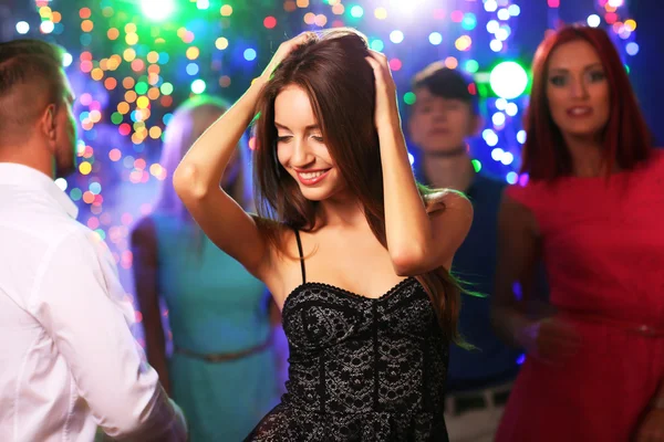 Young people dancing at party Stock Photo by ©belchonock 55638687