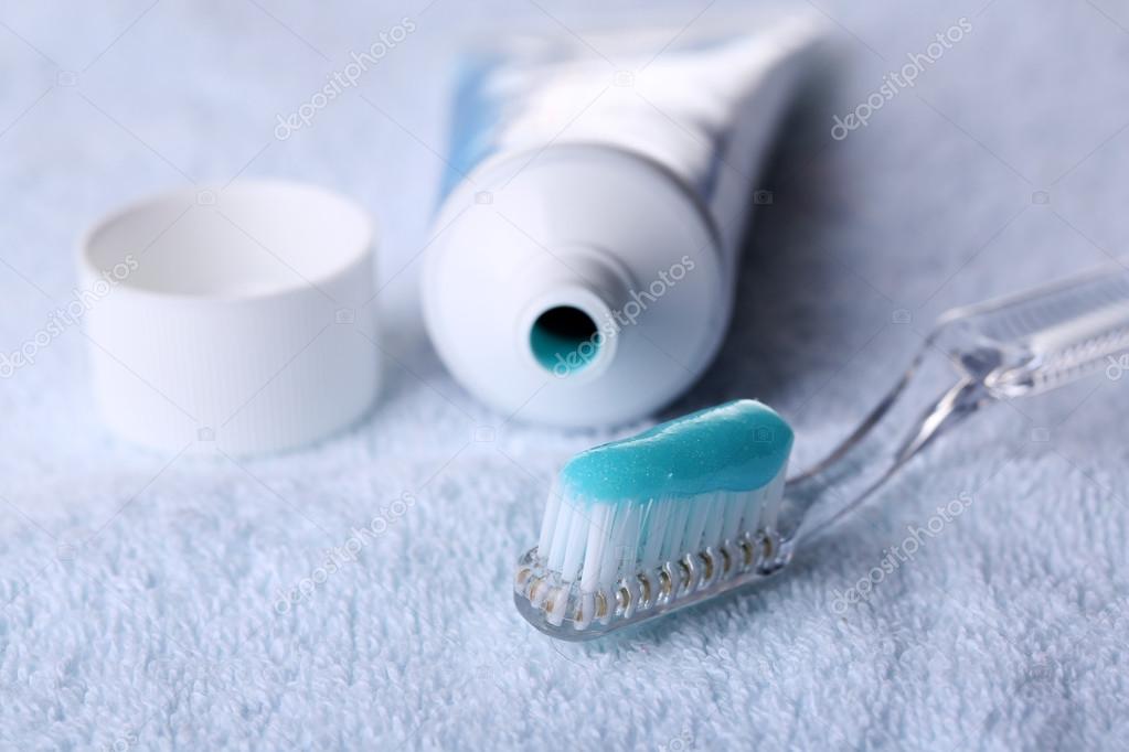 Toothbrush with blue toothpaste — Stock Photo © belchonock #55645967