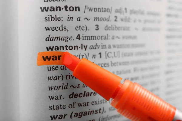 Marker highlighting word in dictionary Stock Photo by ©belchonock 56595037