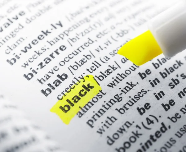 Marker highlighting word in dictionary Stock Photo by ©belchonock 56595037