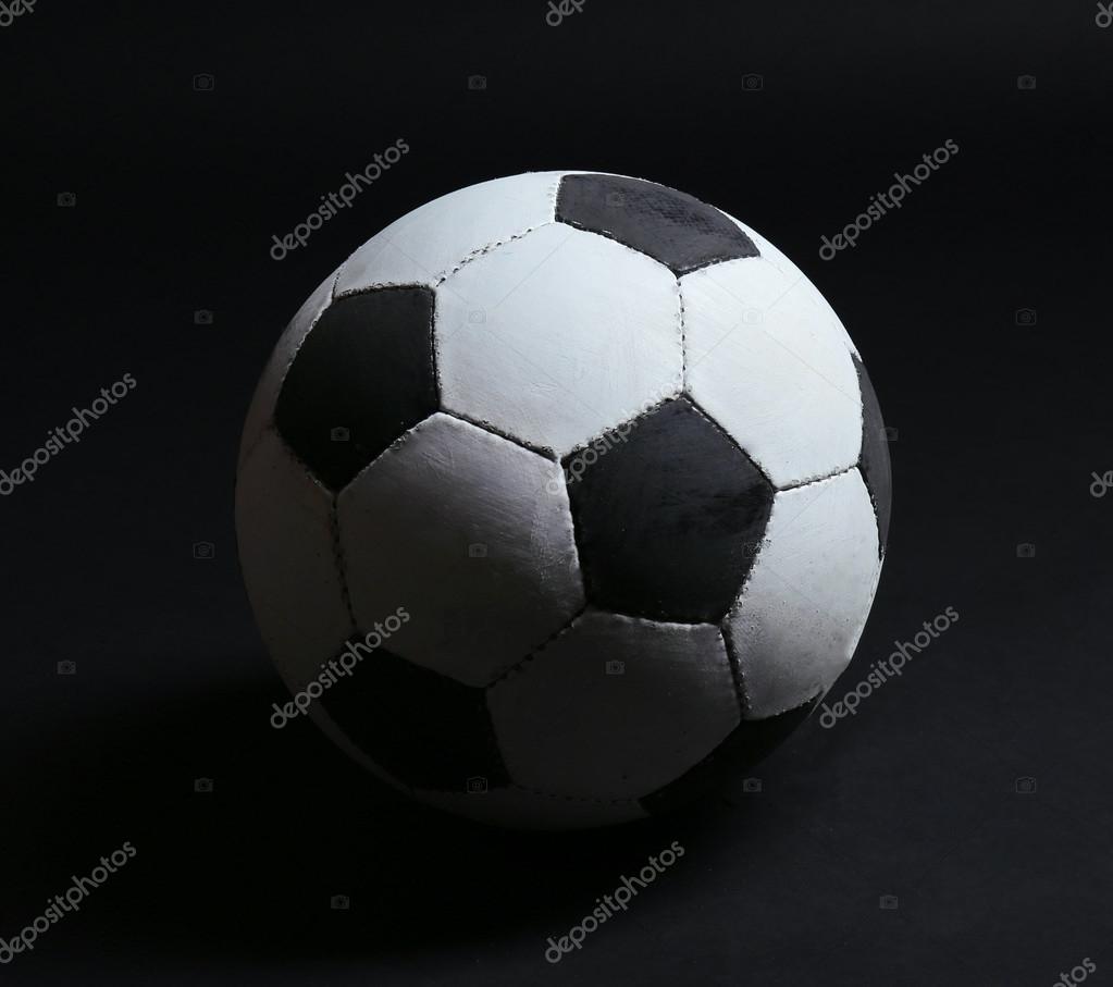 Soccer ball on black background Stock Photo by ©belchonock 61011031