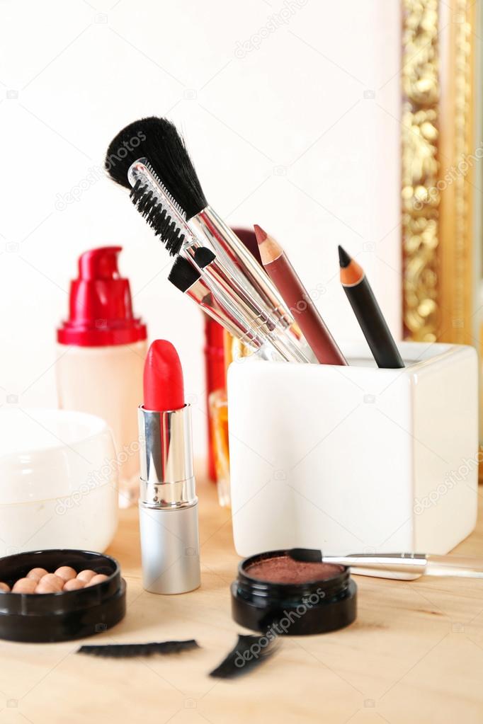 Different cosmetics on dressing table, close up Stock Photo by ...