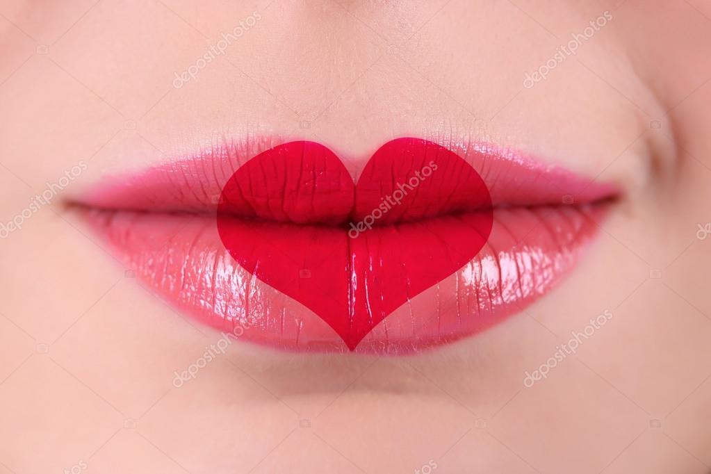 Love concept. Sexy lips with heart shape paint, closeup Stock Photo by ...