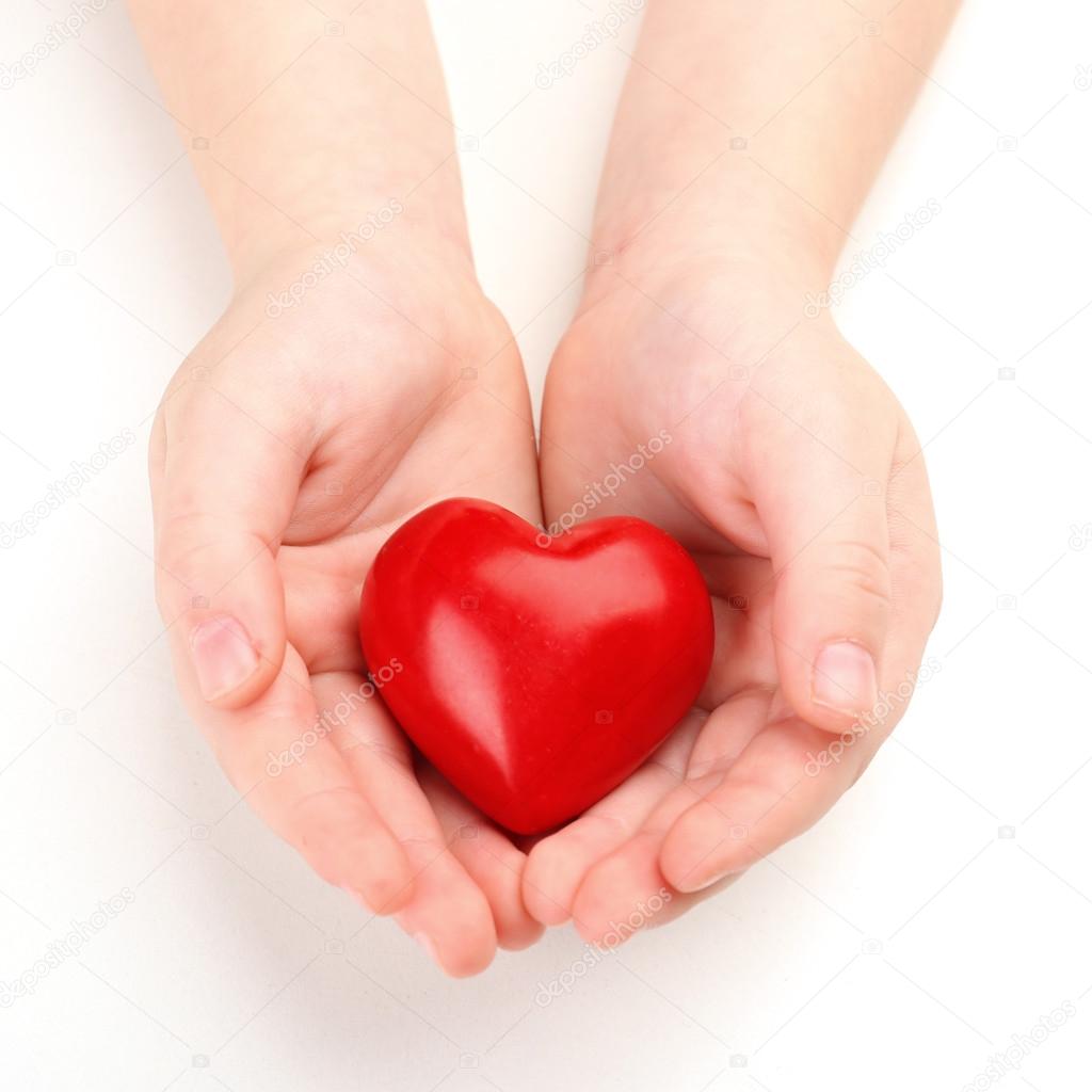 Heart in child hands — Stock Photo © belchonock #64714395