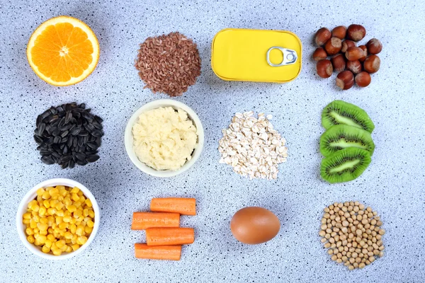 Various food products containing vitamins on table Stock Photo by ...