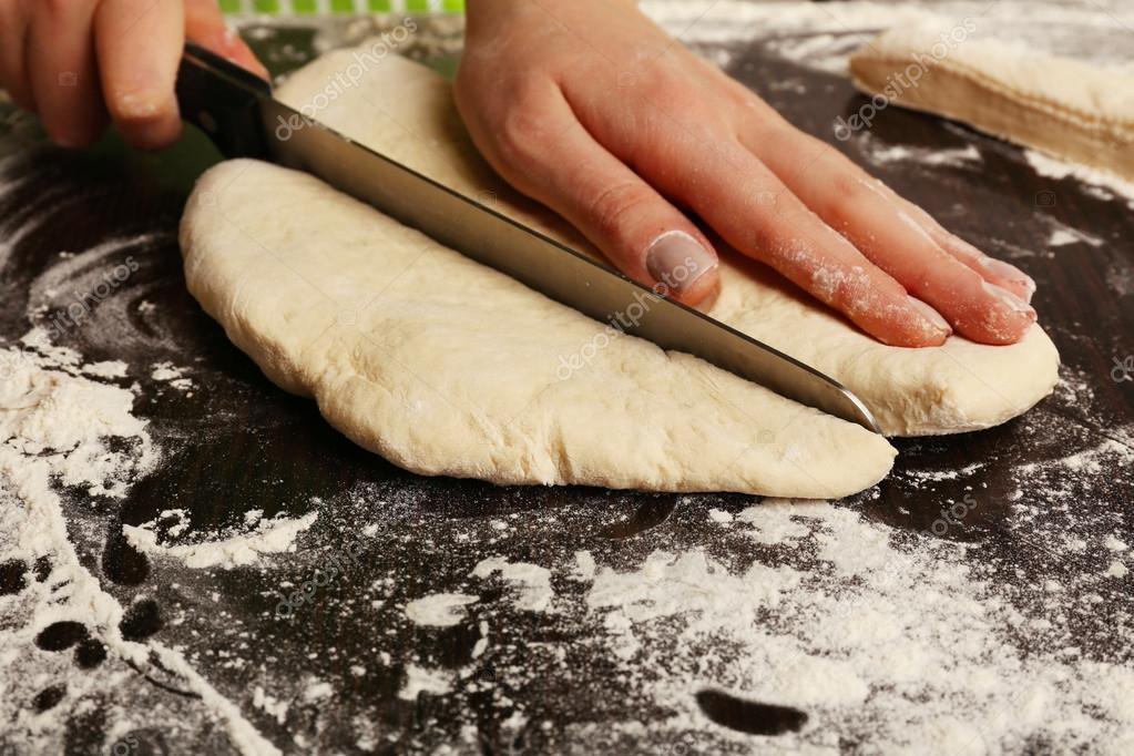 Making bread by female hands on wooden table background Stock Photo by ...