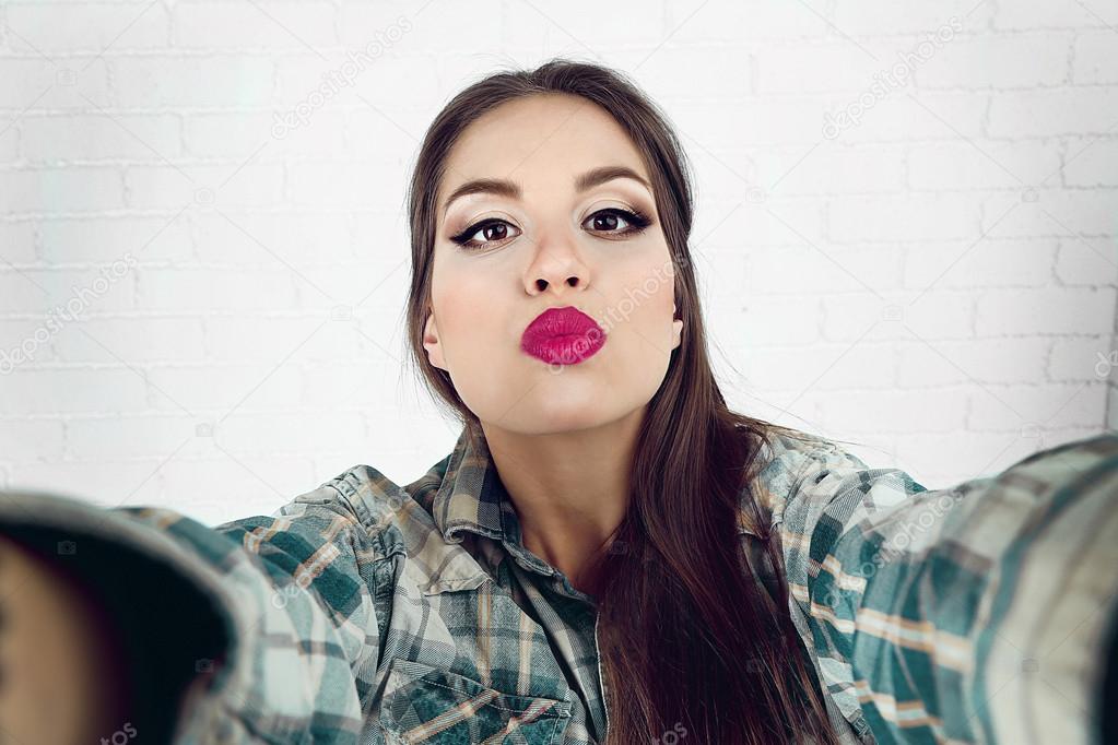 Beautiful Stylish Girl Making Selfie On Brick Wall Background Stock