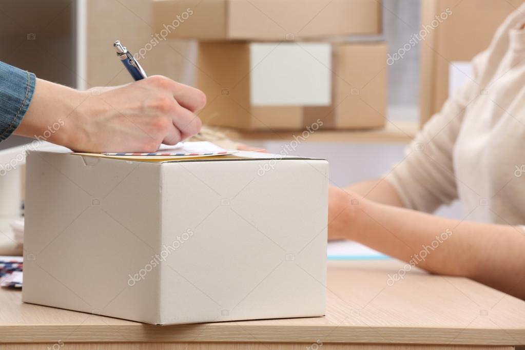 Woman working in post office — Stock Photo © belchonock #71379777