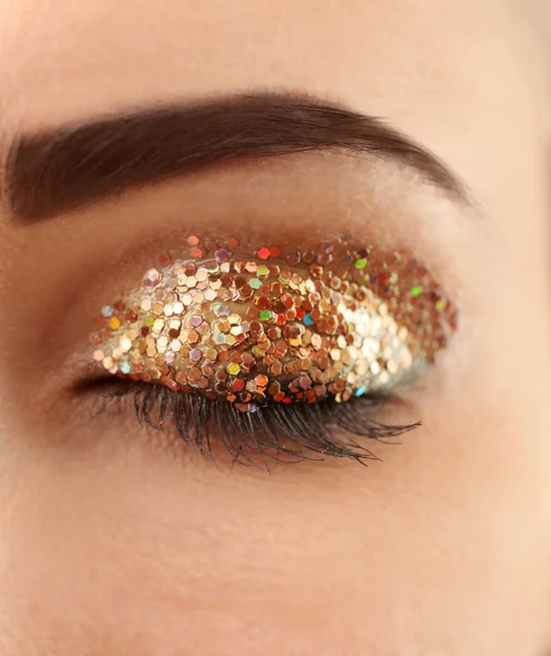 Female eye with fancy glitter makeup, macro view - Stock Image - Everypixel