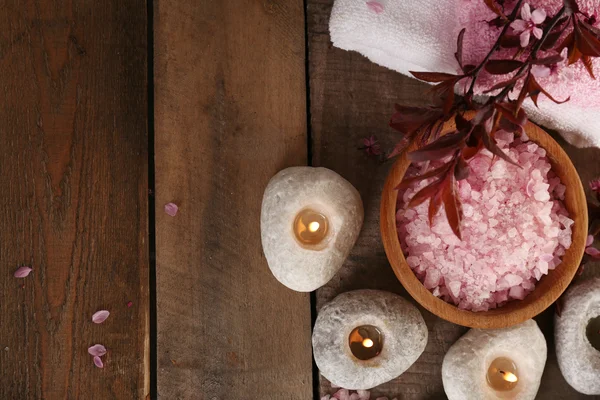 Beautiful spa composition with spring flowers on wooden background ...
