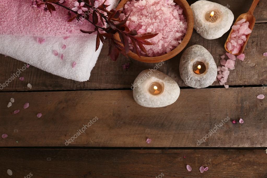 Beautiful spa composition with spring flowers on wooden background ...