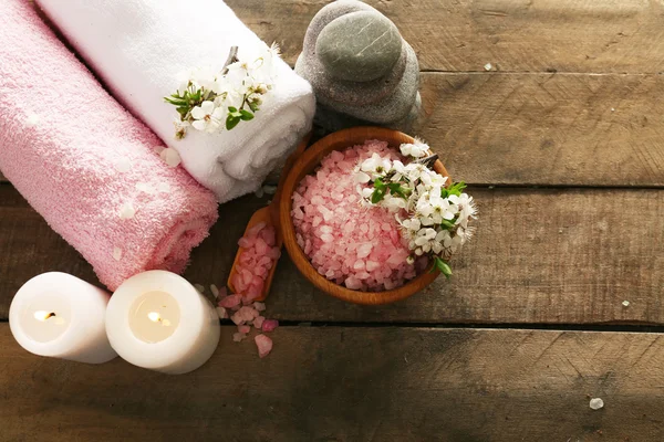 Beautiful spa composition with spring flowers on wooden background ...