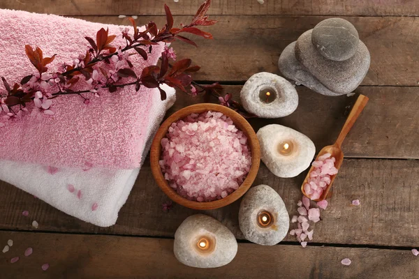 Beautiful spa composition with spring flowers on wooden background ...