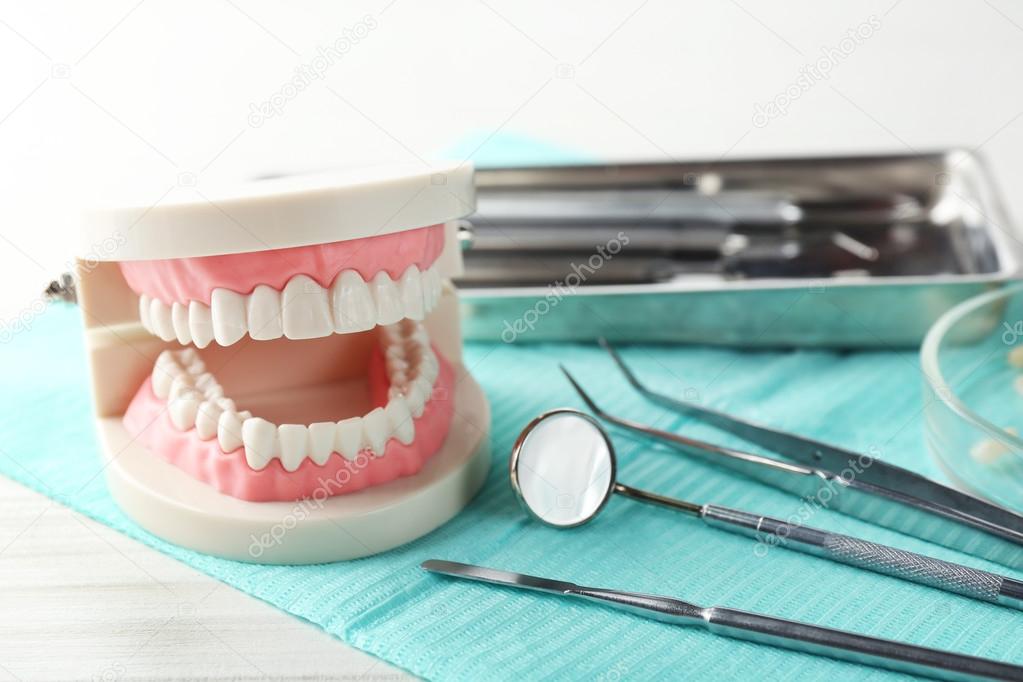White teeth and dental instruments Stock Photo by ©belchonock 72911761