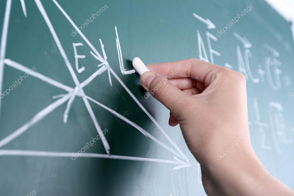 Female hand writing formulas — Stock Photo © belchonock #73618879