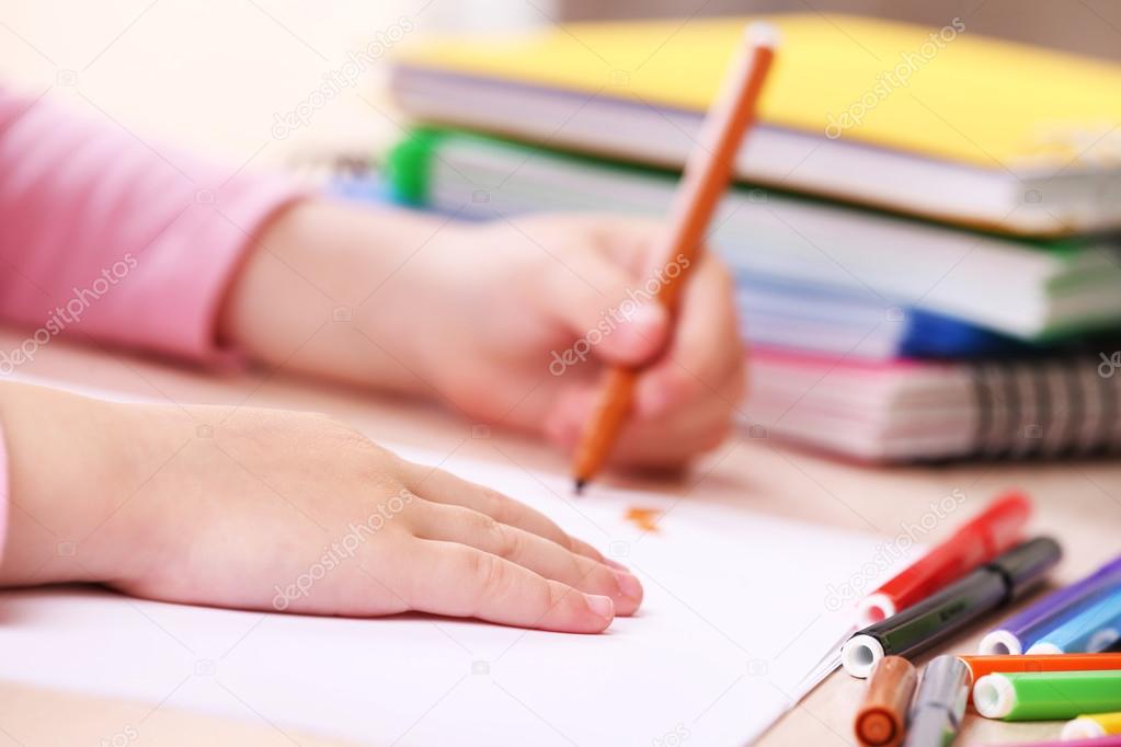 Kids hands drawing on notebook at desktop, closeup Stock Photo by ...