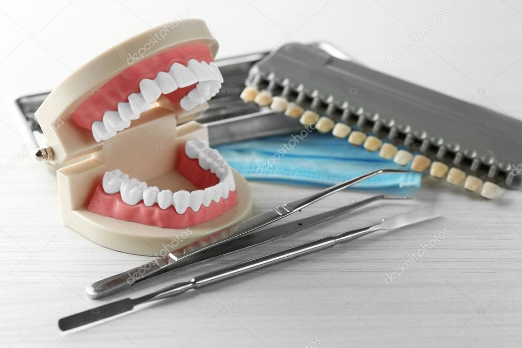 White teeth and dental instruments on table background Stock Photo by ...