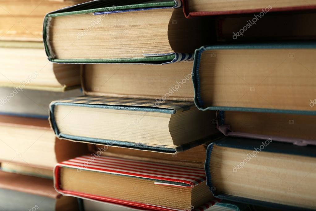 Stack of books background Stock Photo by ©belchonock 74676177