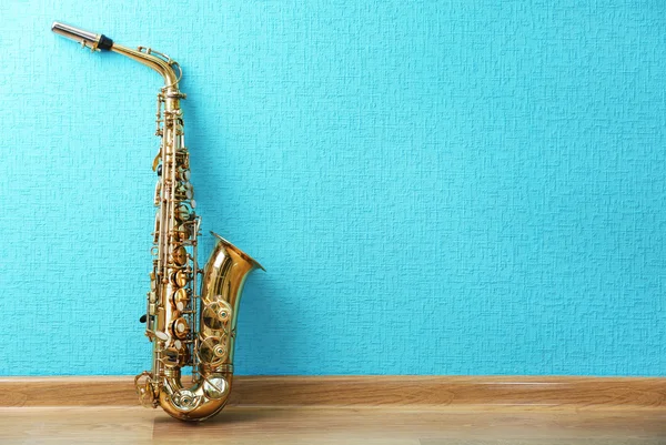 Saxophone on turquoise wallpaper background - Stock Image - Everypixel