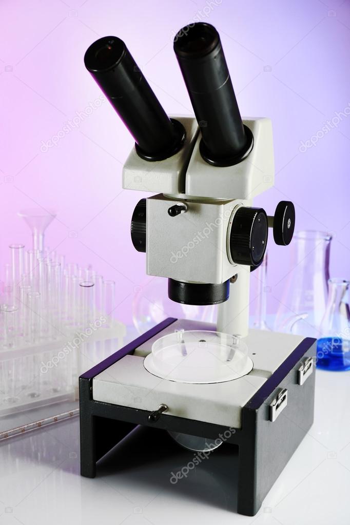 Test tubes and microscope on bright background — Stock Photo ...