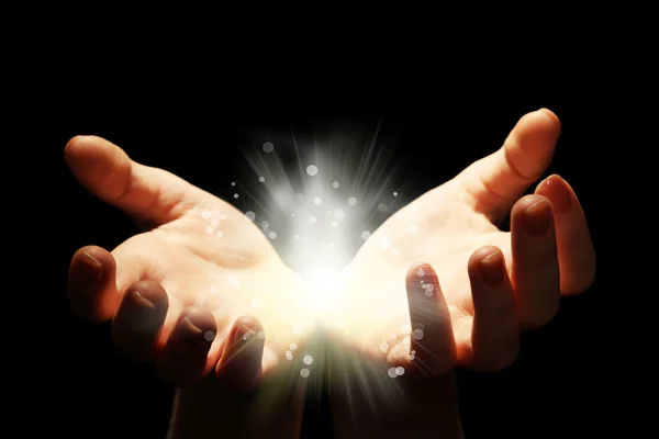 Light in the human hands in the dark Stock Photo by ©belchonock 78066756