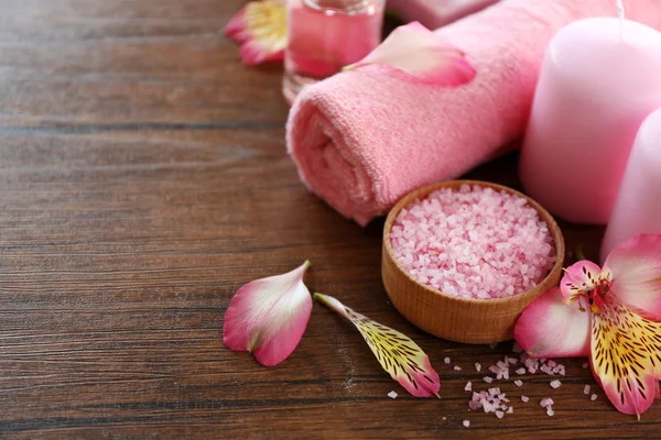 Beautiful spa composition with spring flowers on wooden background ...