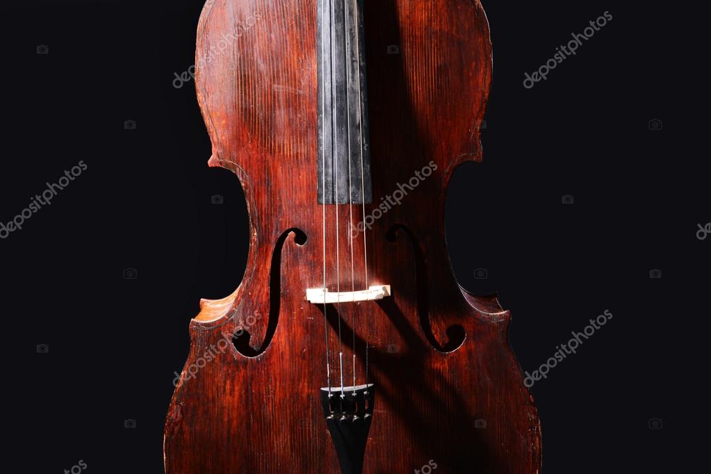 Vintage cello on dark background — Stock Photo © belchonock #78344538