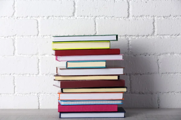 Stack of books on shelf. Stock Photo by ©belchonock 77454986