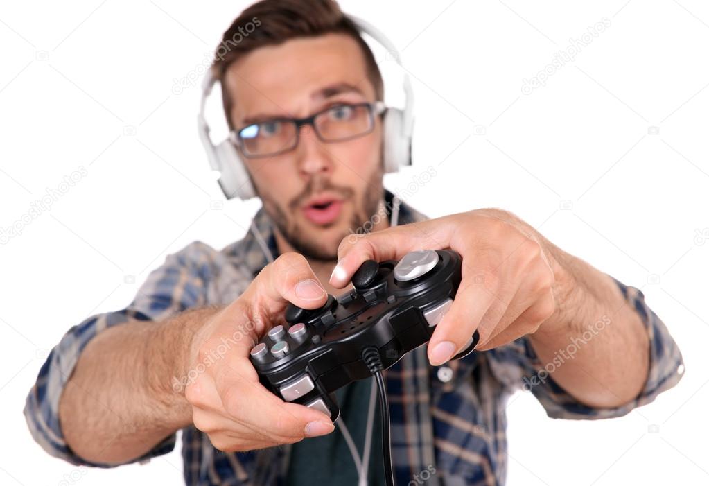 Young man playing video games — Stock Photo © belchonock #80654906
