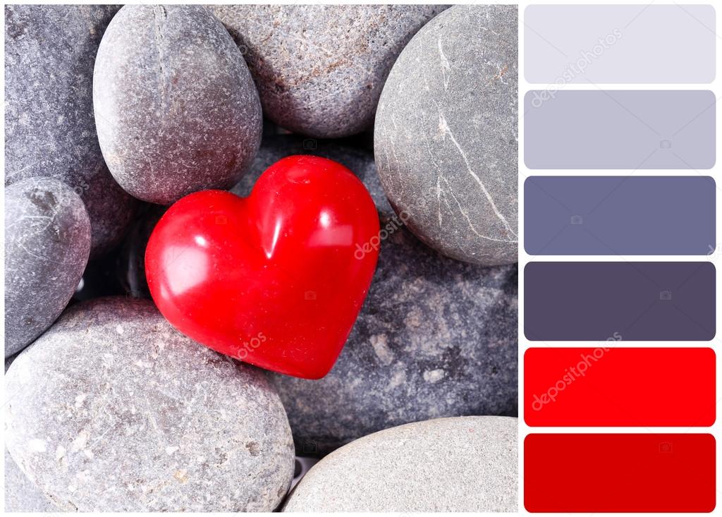 Red heard over pebbles background and palette of colors — Stock Photo ...