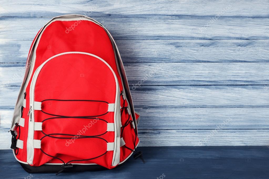 School backpack on wooden background — Stock Photo © belchonock #81256770