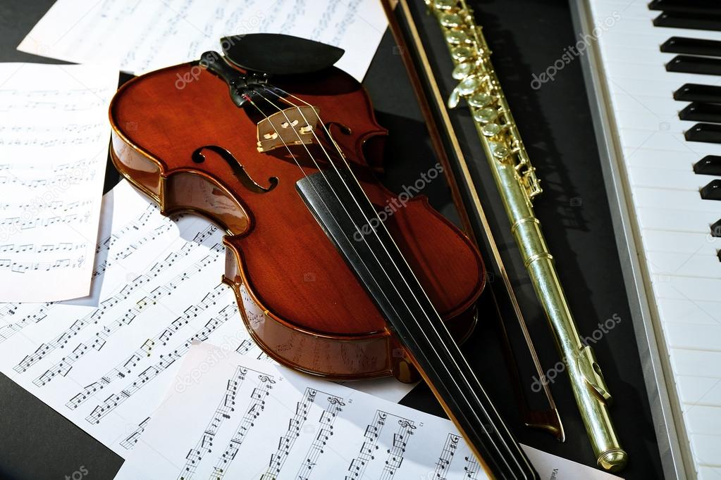 Musical instruments with music notes on dark background — Stock Photo ...